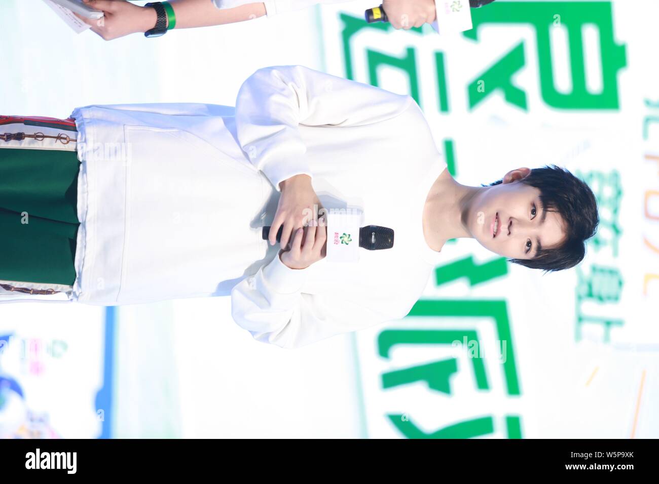 Karry Wang Jun Kai of Chinese boy group TFBoys attends a promotional ...