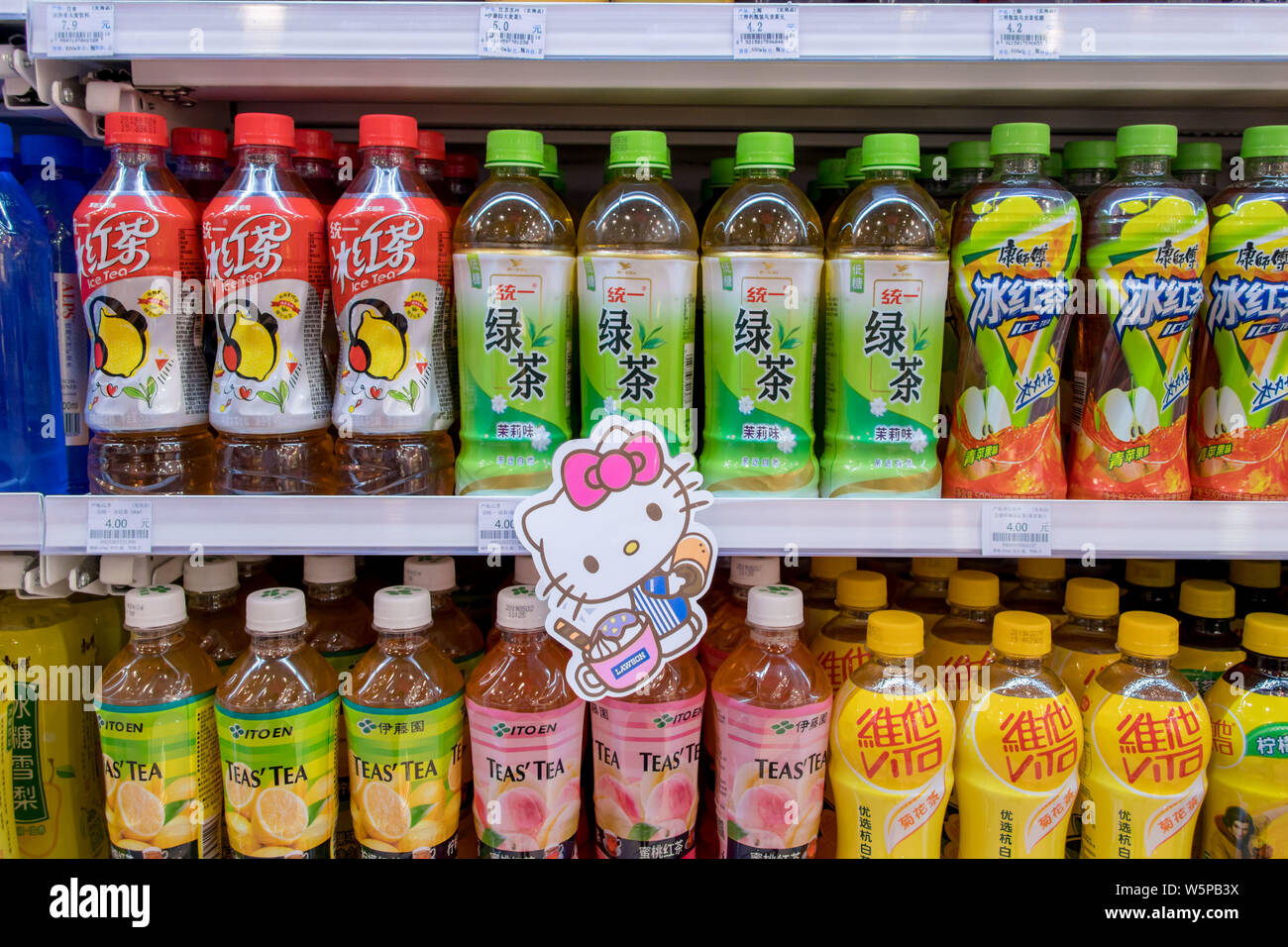 Customers shop at a Hello Kitty-themed Lawson convenience store in ...