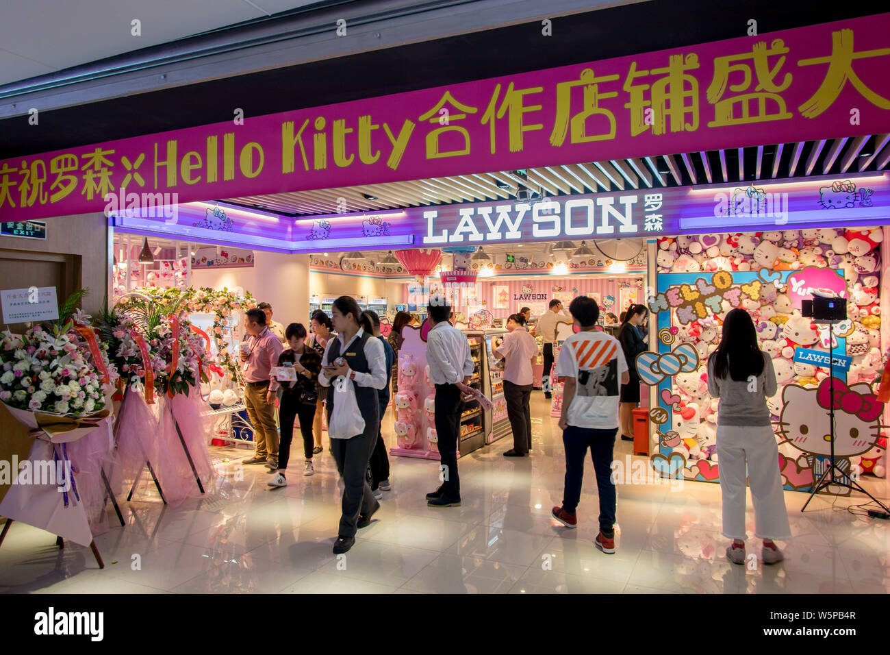 Customers shop at a Hello Kitty-themed Lawson convenience store in ...