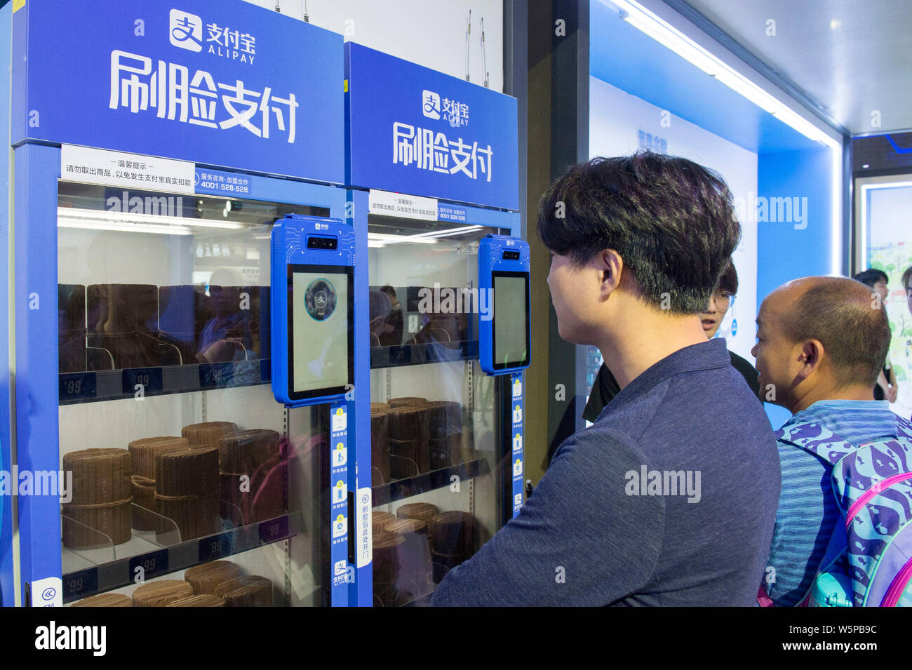 A visitor has his face scanned by a face recognition system supported ...