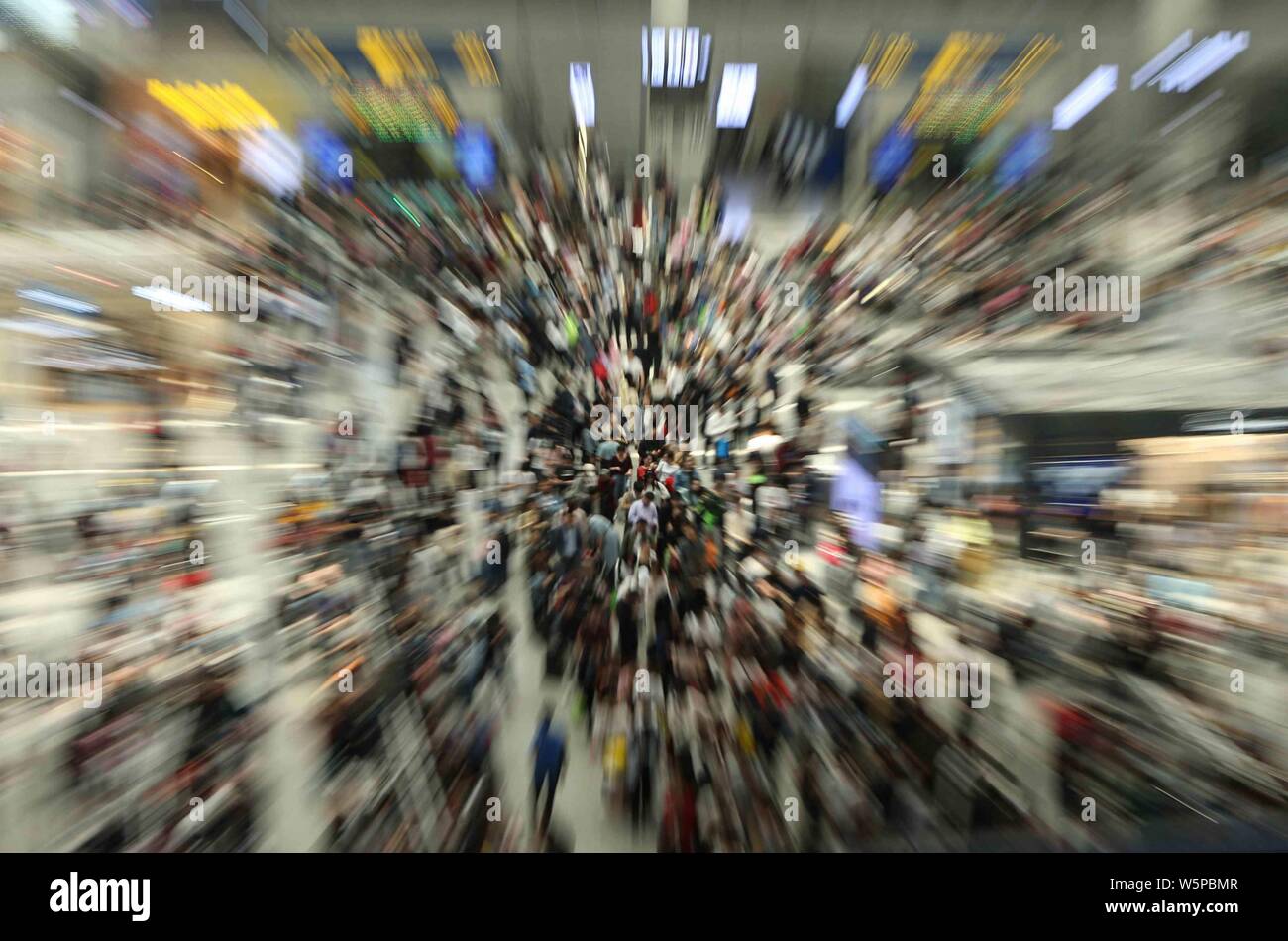 Chinese passengers wait for their trains during the four-day Labor Day ...