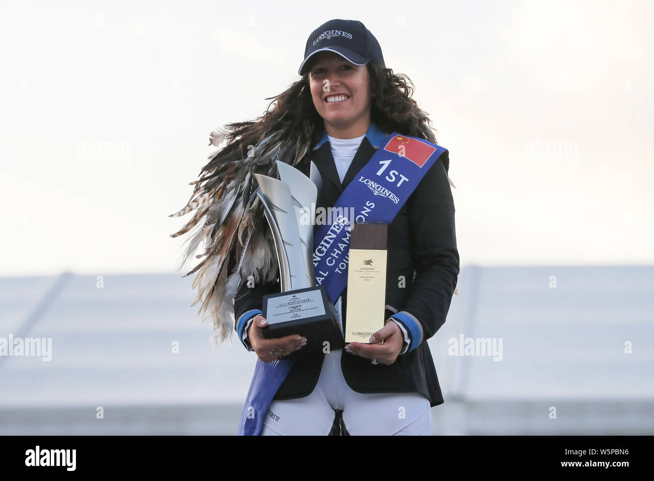 Danielle Goldstein poses with her trophy at the award ceremony after ...