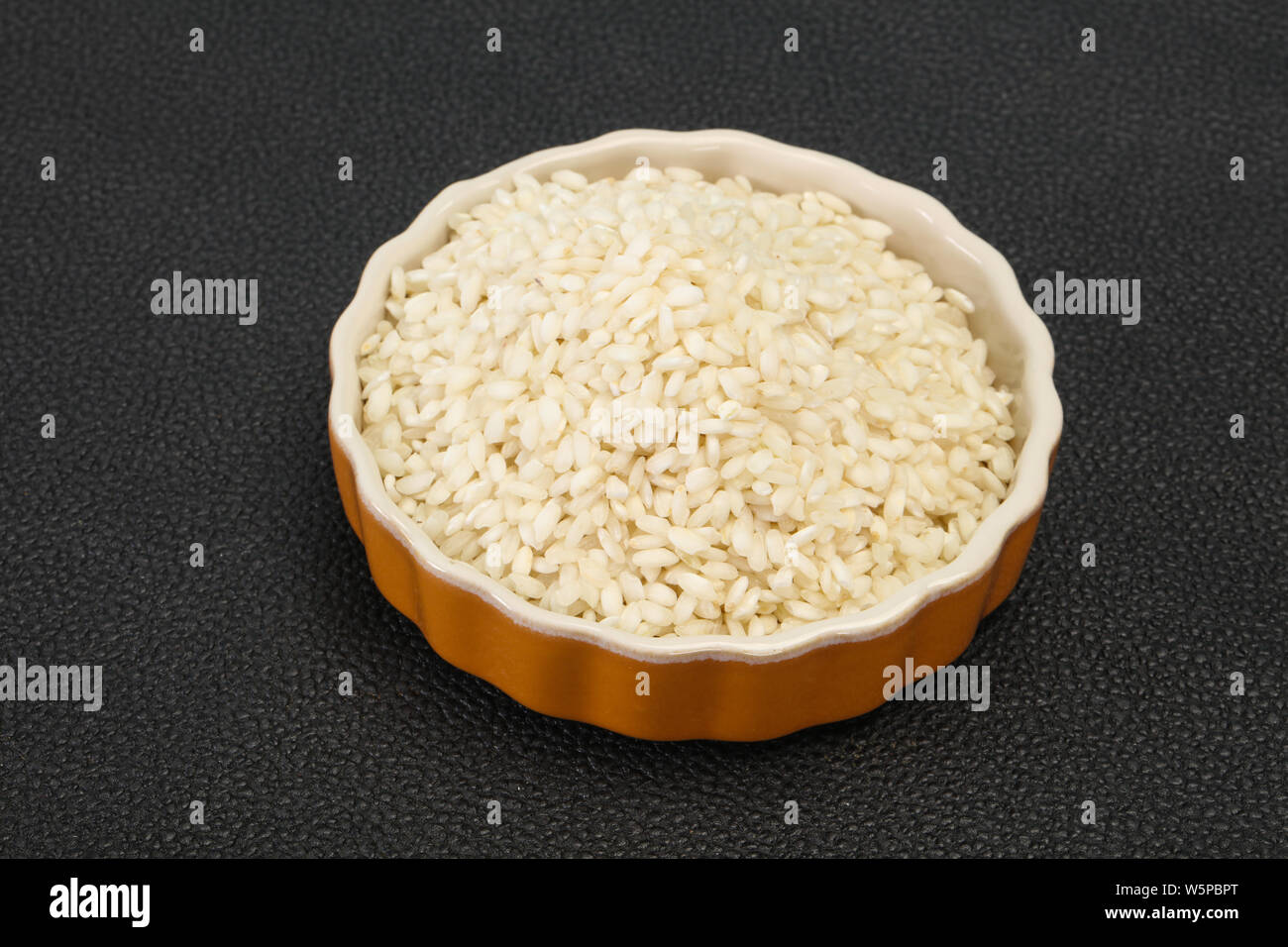 Raw Arborio rice for Italian risotto Stock Photo - Alamy