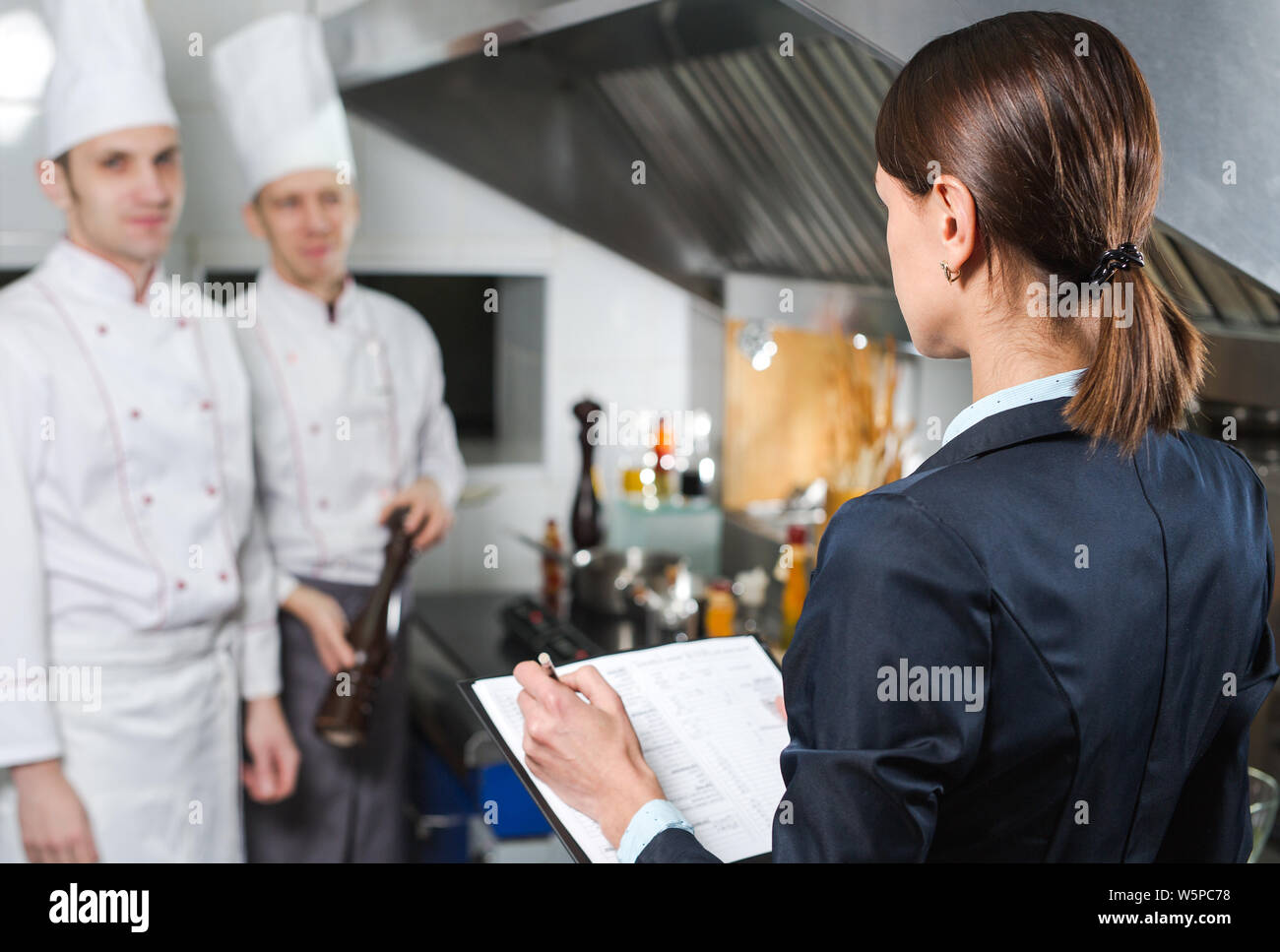 Chefs interacting restaurant manager hi-res stock photography and ...