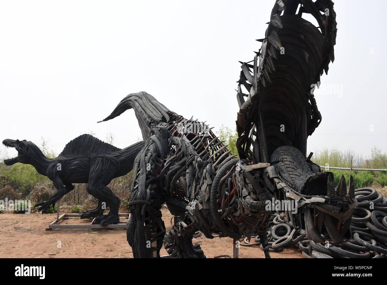 Chinese man Cao Shengge crafts an animal-shaped statue from used tires ...