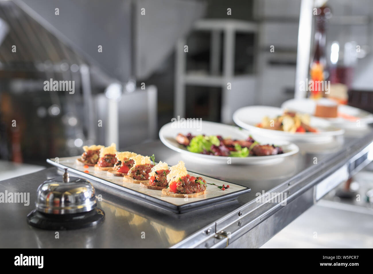 the distribution table in the kitchen of the restaurant Stock Photo - Alamy