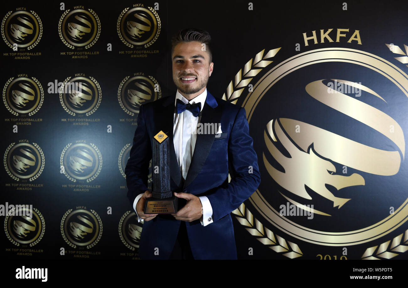 Brazilian football player Igor Sartori poses with his trophy after ...
