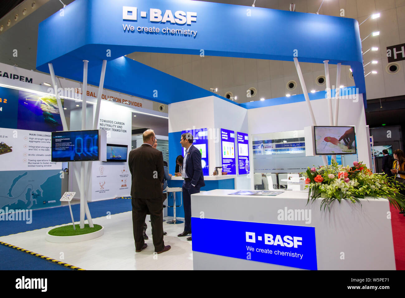--FILE--People visit the stand of German chemical giant BASF during the ...