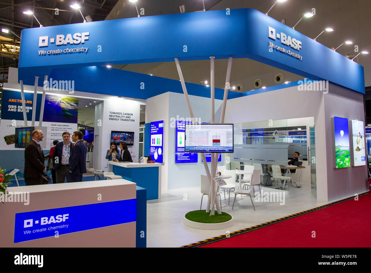 --FILE--People visit the stand of German chemical giant BASF during the ...