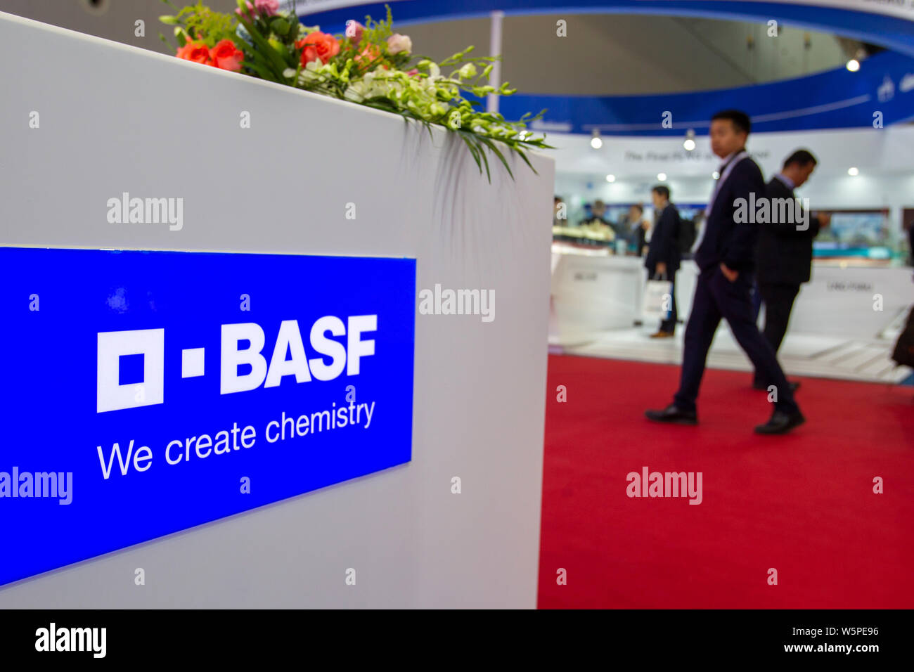 --FILE--People visit the stand of German chemical giant BASF during the ...