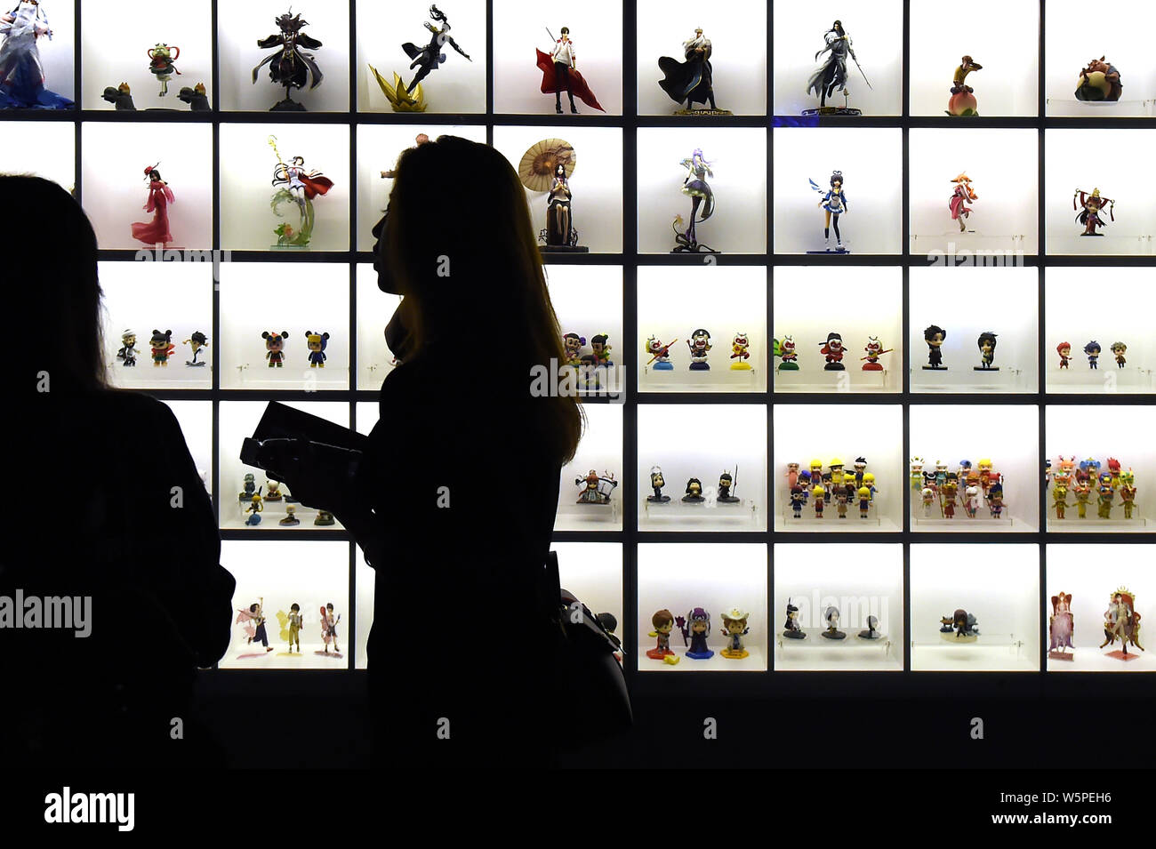 Statuettes of Chinese animation figures are on display at a pop-up ...
