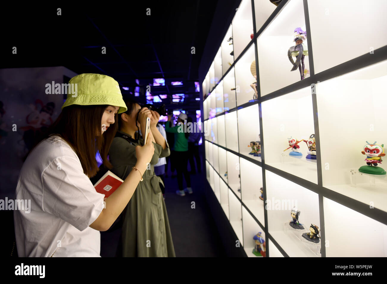 Statuettes of Chinese animation figures are on display at a pop-up ...