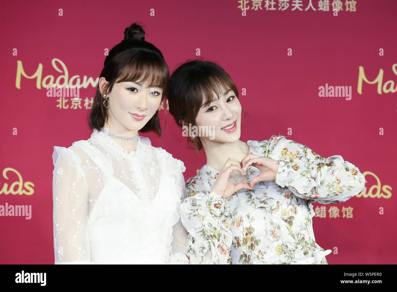 Chinese actress Andy Yang or Yang Zi poses with the wax figure of her ...