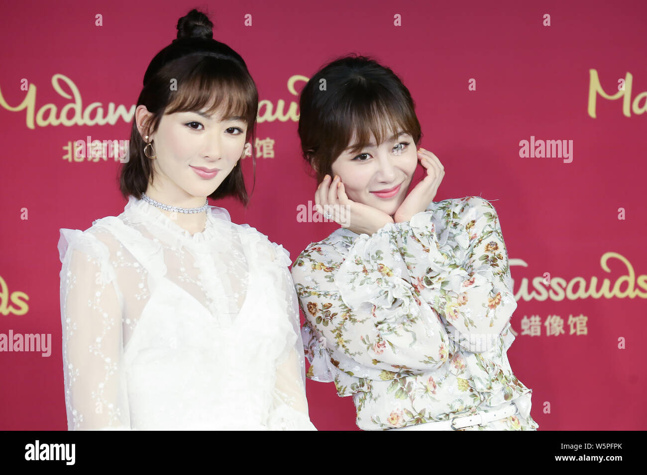 Chinese actress Andy Yang or Yang Zi poses with the wax figure of her ...