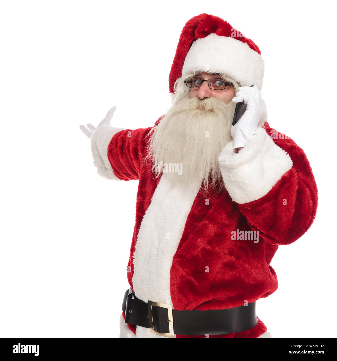 portrait of santa claus talking on the phone making and inviting ...