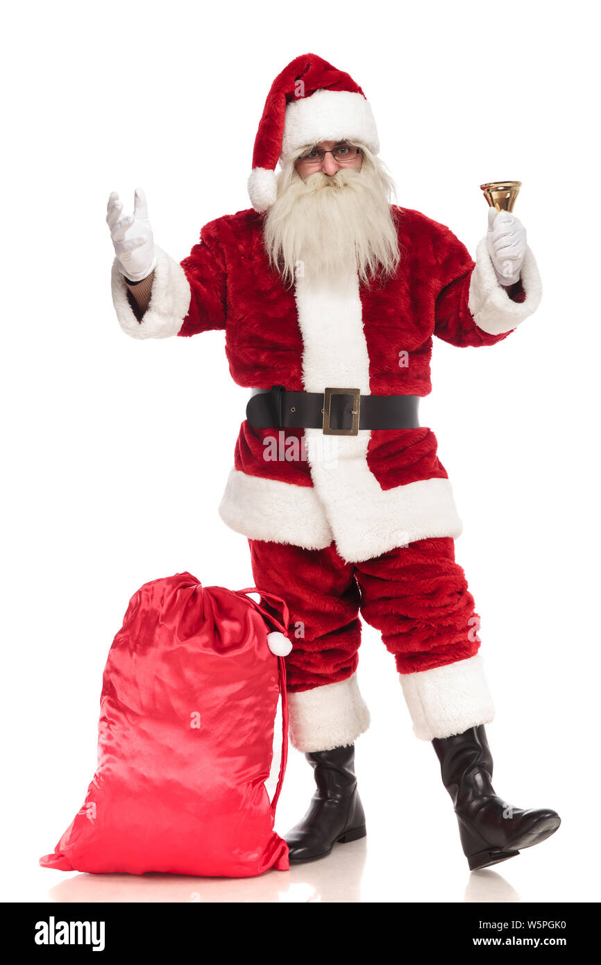 santa claus standing on white background with sack near his leg rings ...