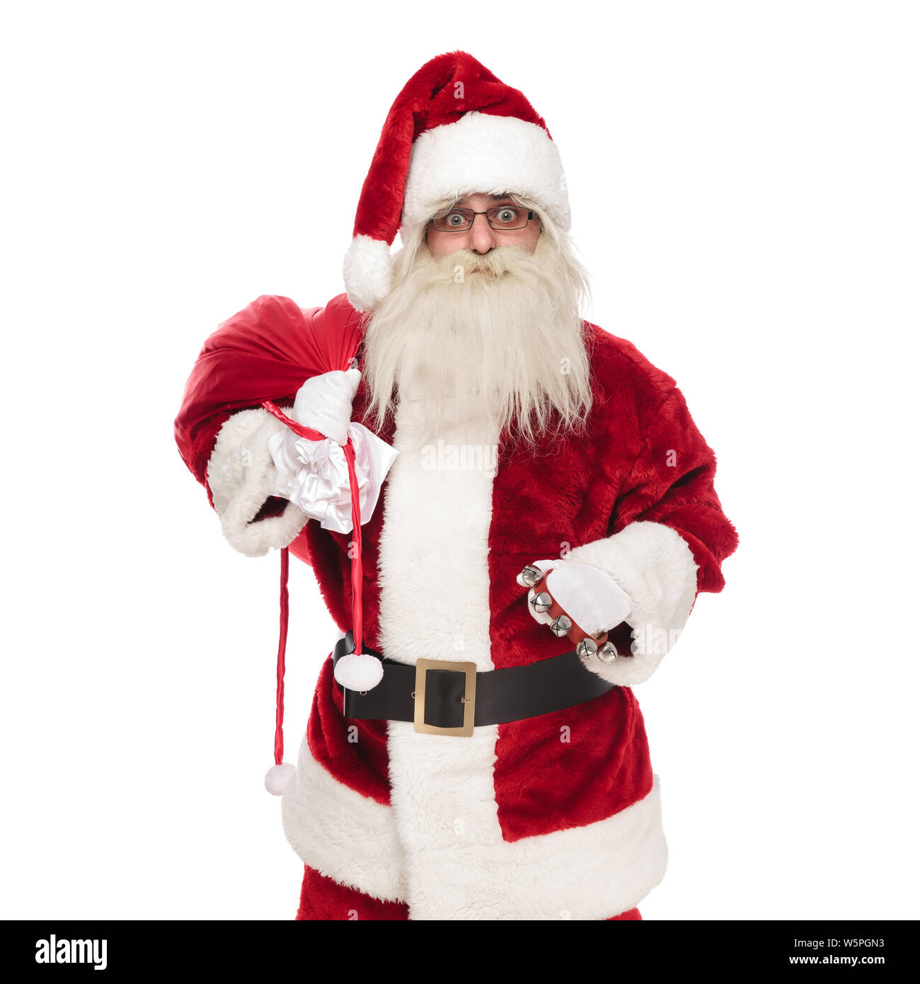 portrait of old saint nick ringing his bells while standing on white ...