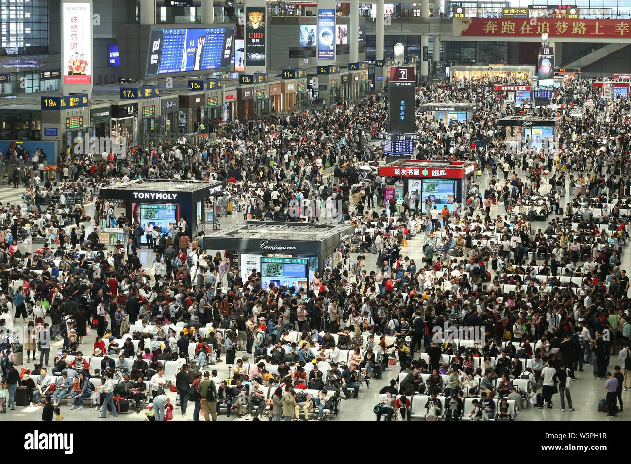 Chinese passengers wait for their trains during the four-day Labor Day ...