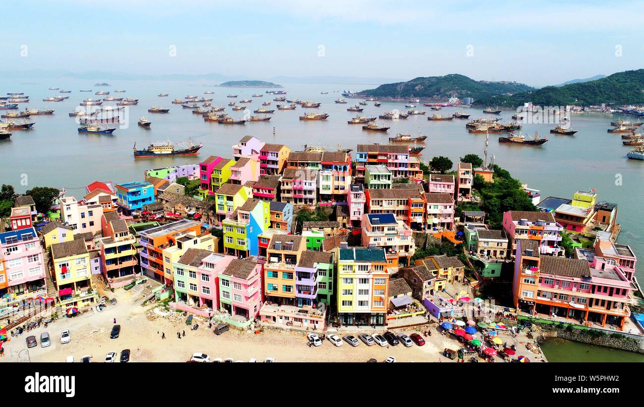 A cluster of colorful houses is seen at a village in Wenling city, east ...
