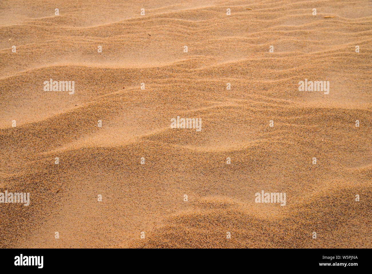 Sand of a beach with patterns Stock Photo - Alamy