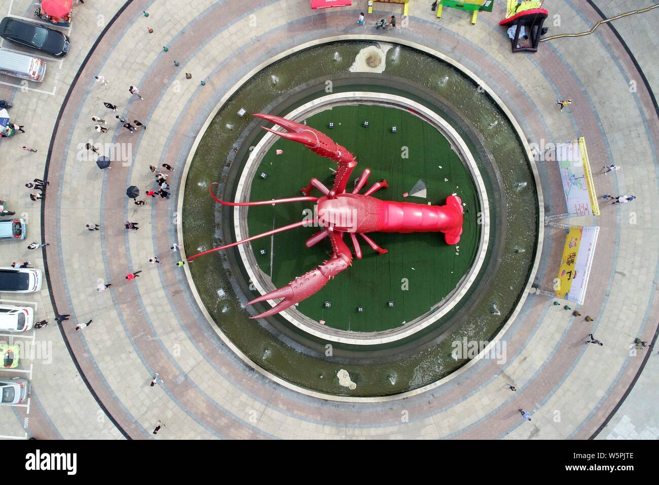 A huge sculpture featuring the shape of crayfish is displayed at a ...