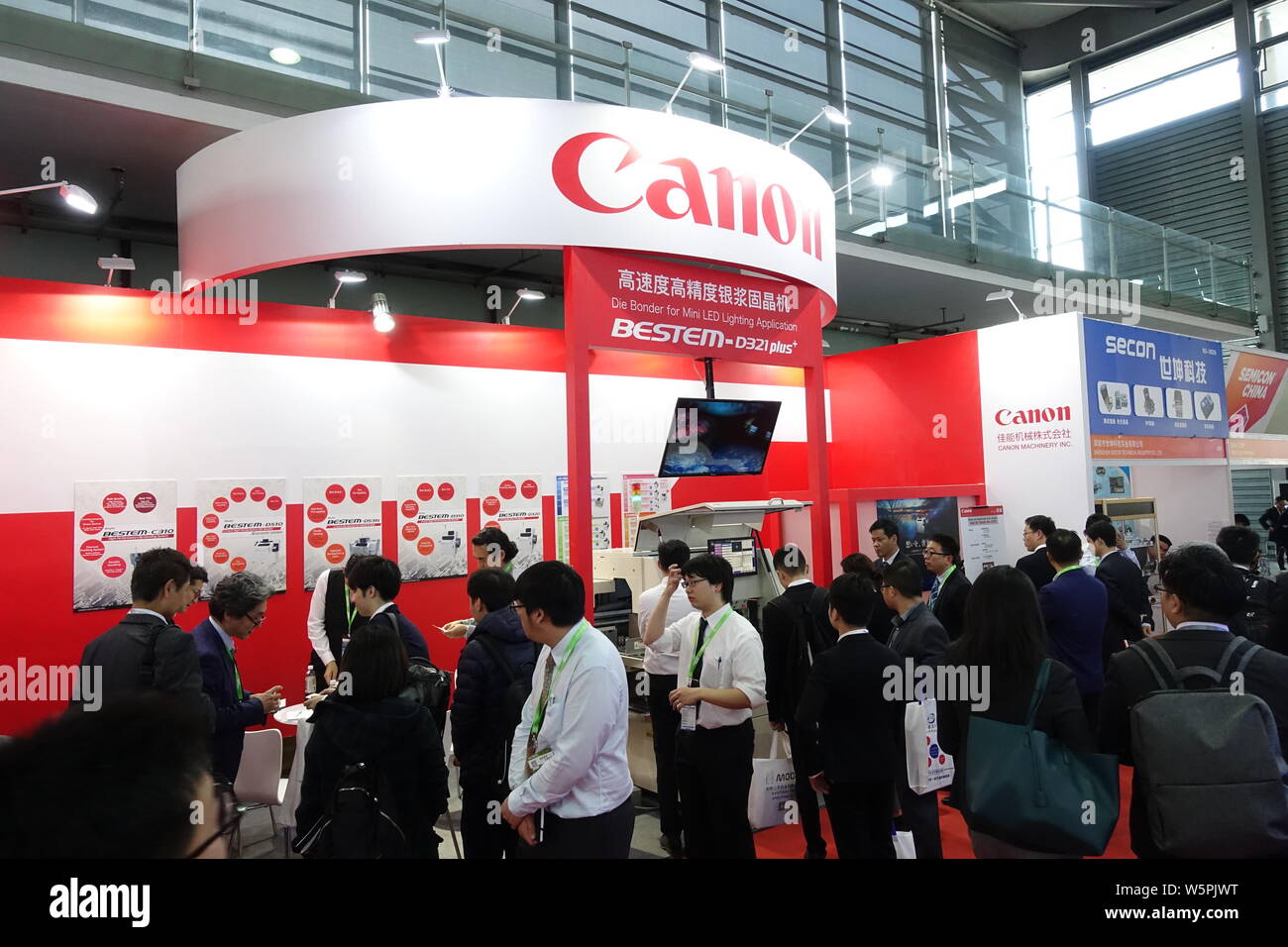 --FILE--People visit the stand of Canon during an exhibition in ...