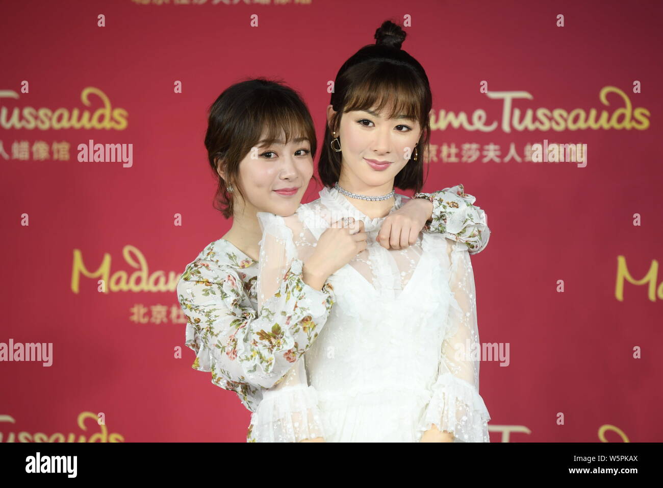Chinese actress Andy Yang or Yang Zi poses with the wax figure of her ...