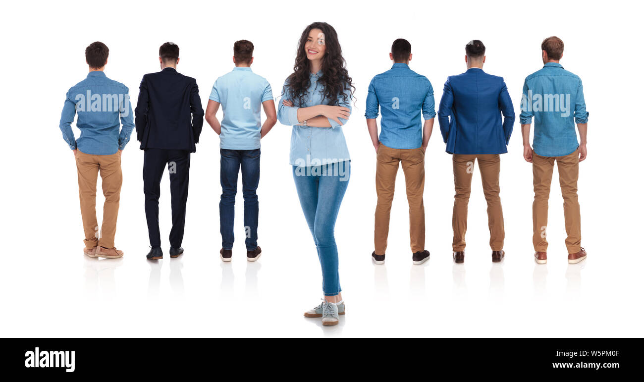 back view of relaxed group of men standing on white background with ...