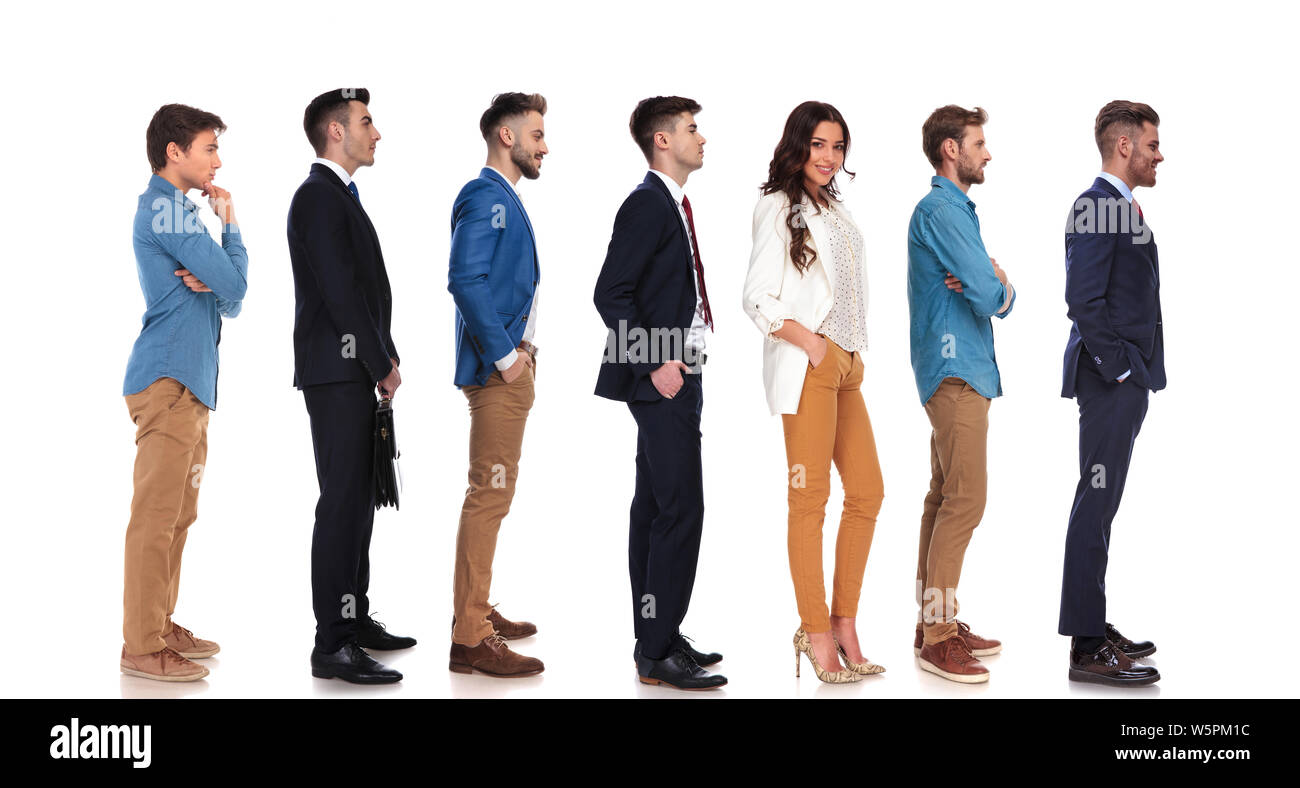 relaxed businesswoman and group of men waiting in line while standing ...