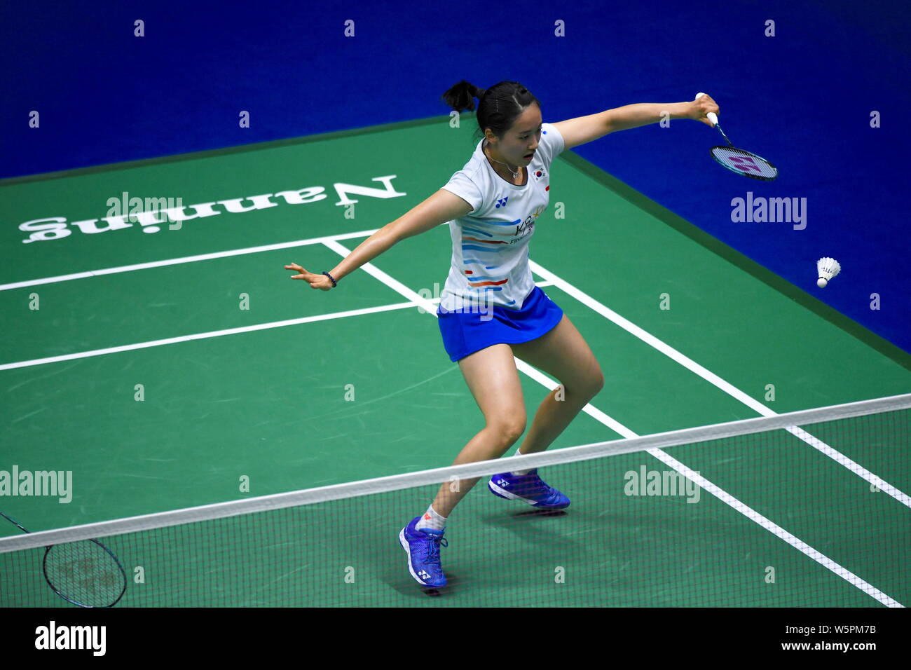 Chae Yoo-jung of South Korea returns a shot to Tang Chun Man and Ng Tsz ...