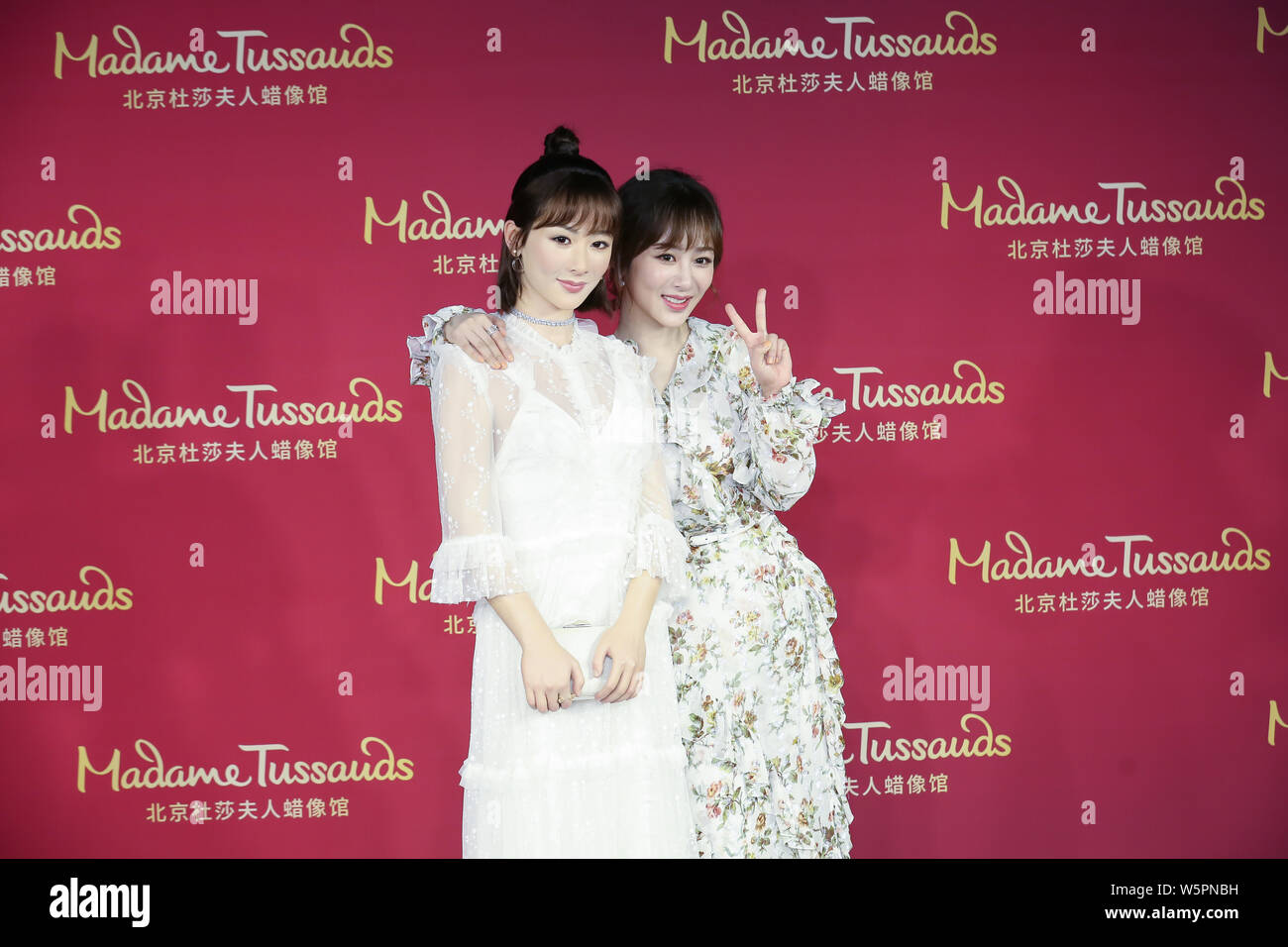 Chinese actress Andy Yang or Yang Zi poses with the wax figure of her ...
