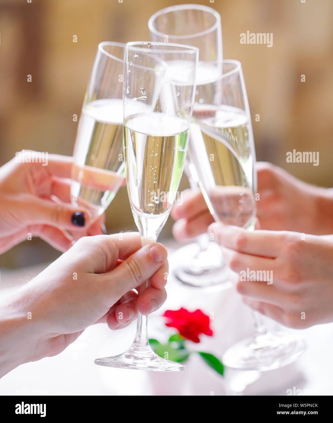 Friends in the restaurant having a toast Stock Photo - Alamy