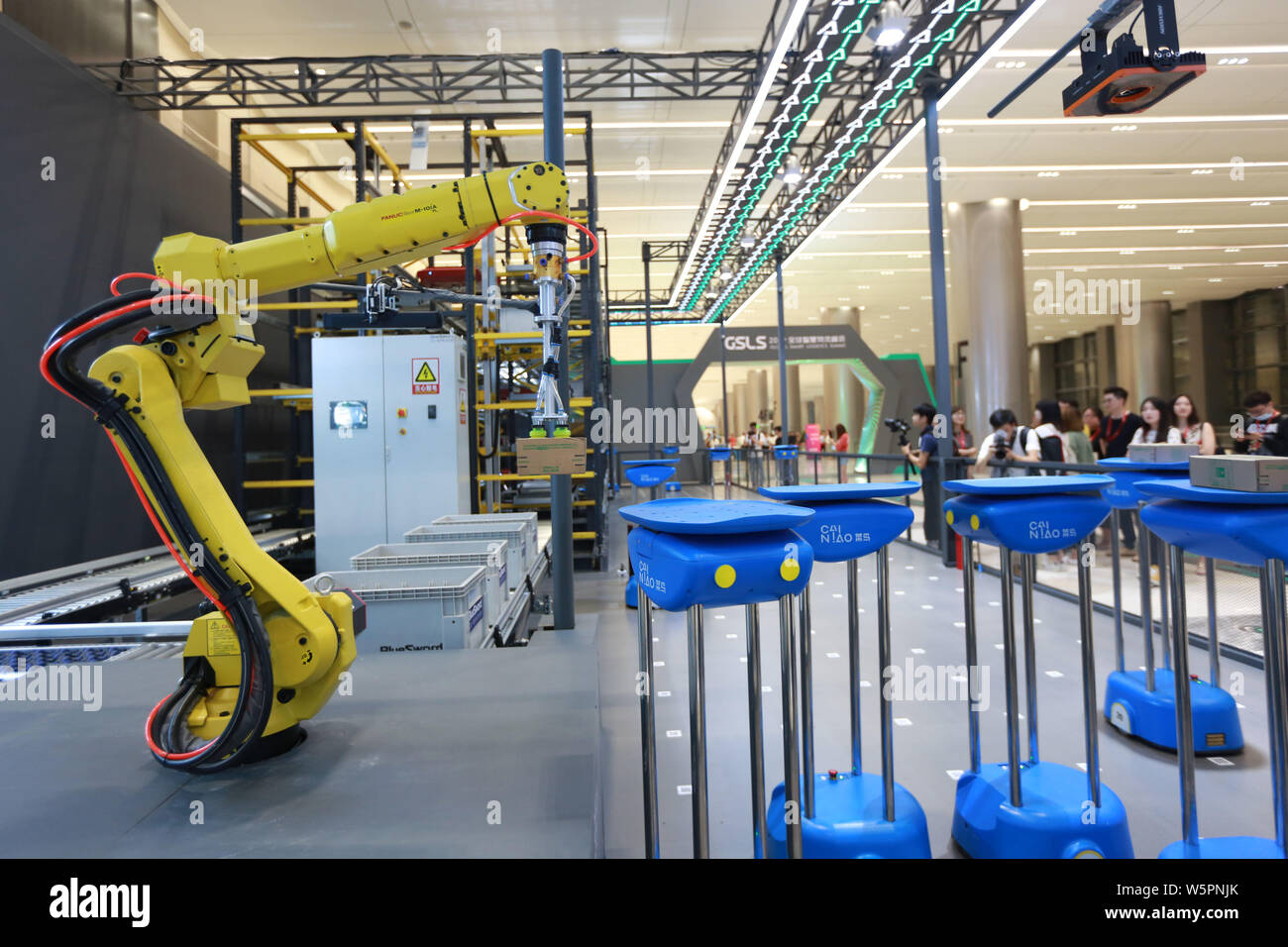 An intelligent logistic warehouse belonging to Cainiao via robotic arms ...