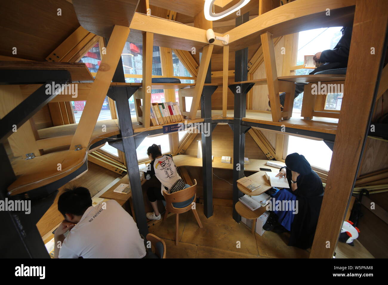 Local residents read books at a reading room resembling a space capsule ...