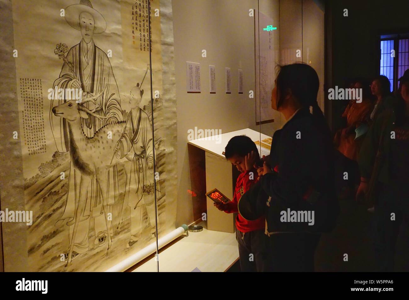 People enjoy the calligraphy and painting made by Emperor Qianlong of ...