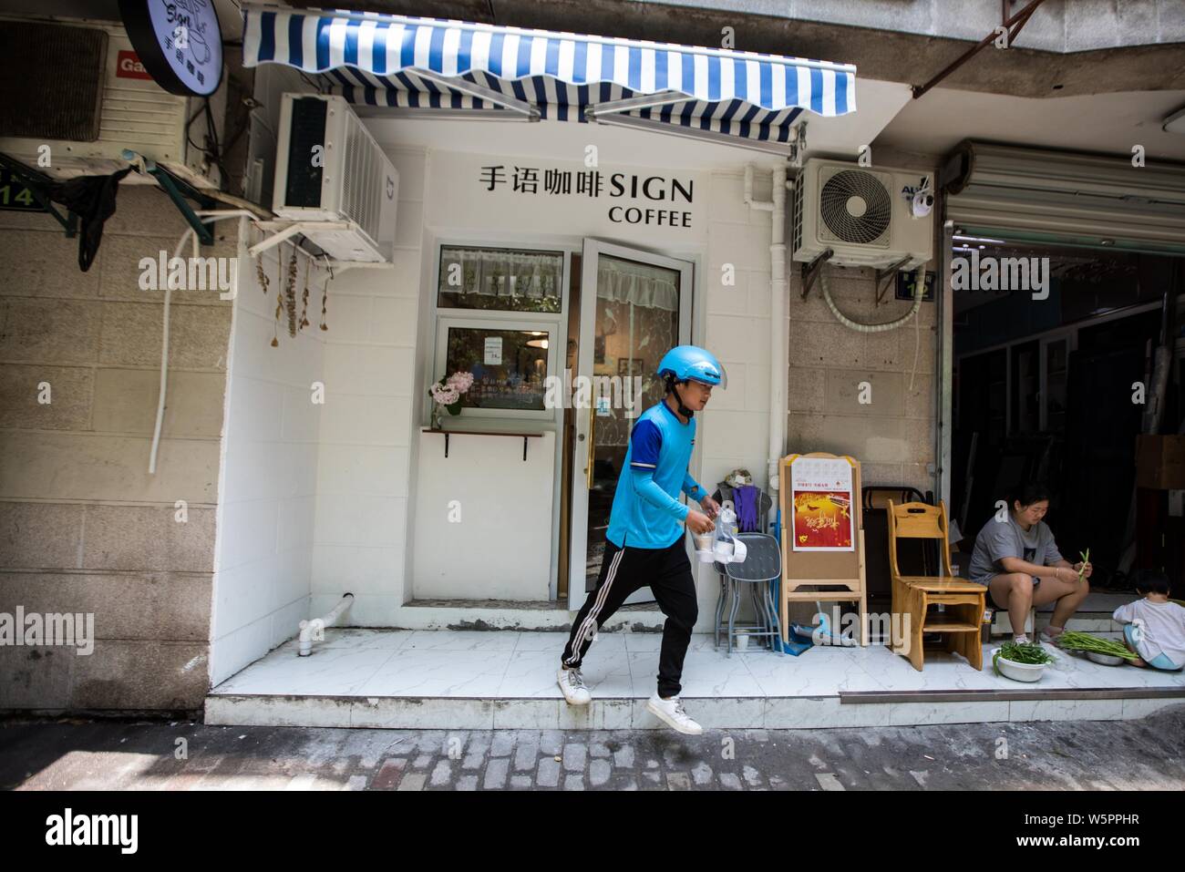 Chinese man Lu Jun and his wife Yang Di serve customers at their ...