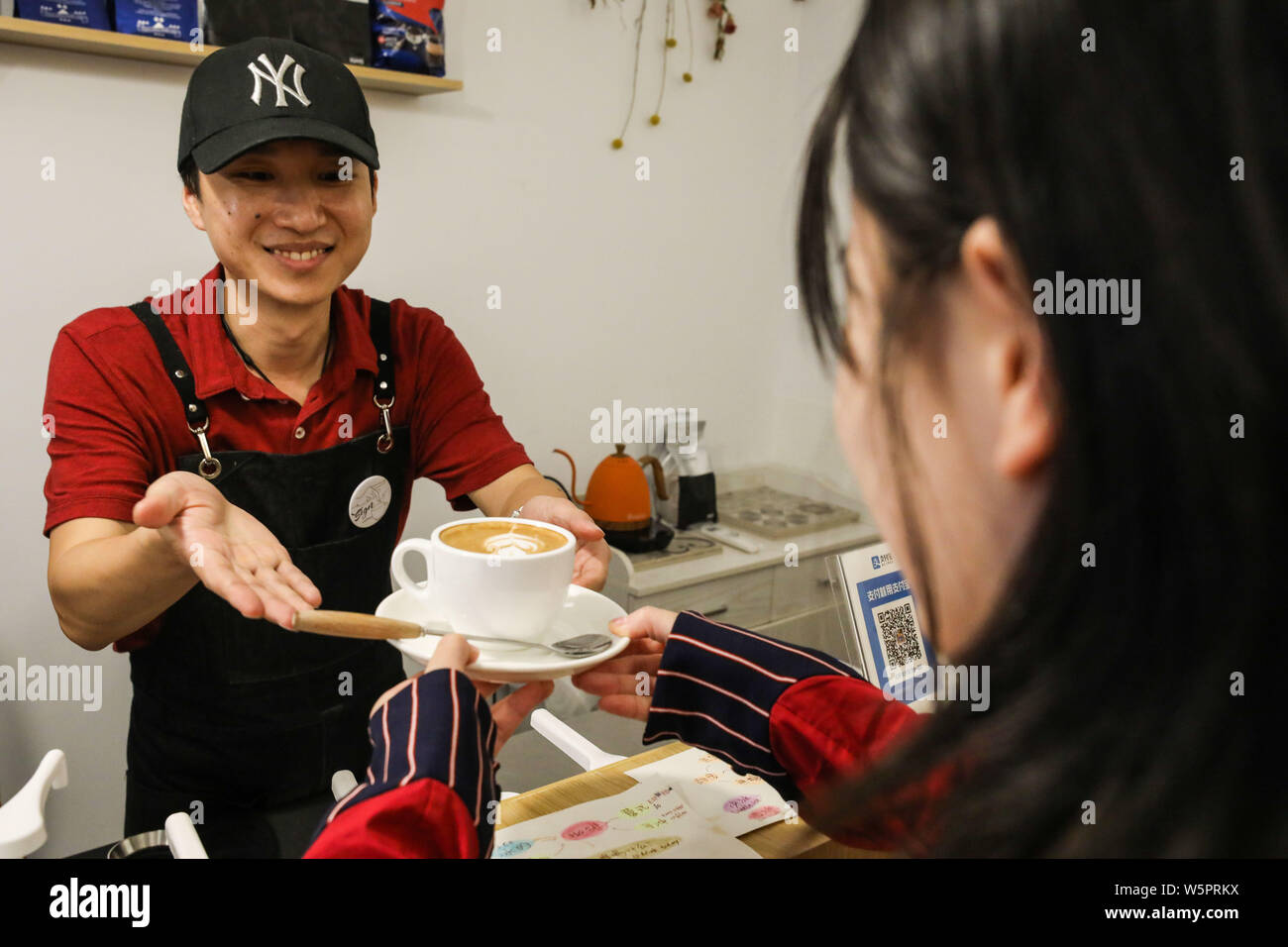 Chinese man Lu Jun and his wife Yang Di serve customers at their ...