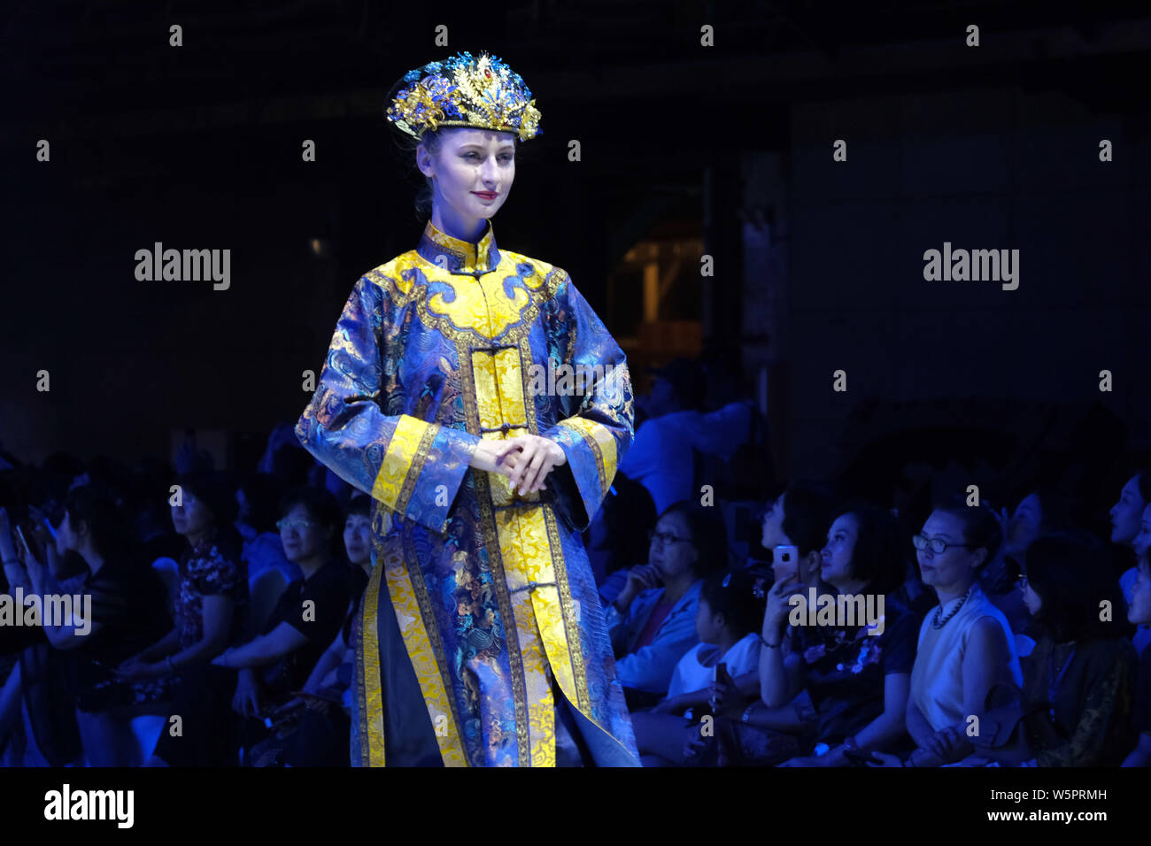 A model dressed in Cheongsam, a traditional Chinese dresses also known ...