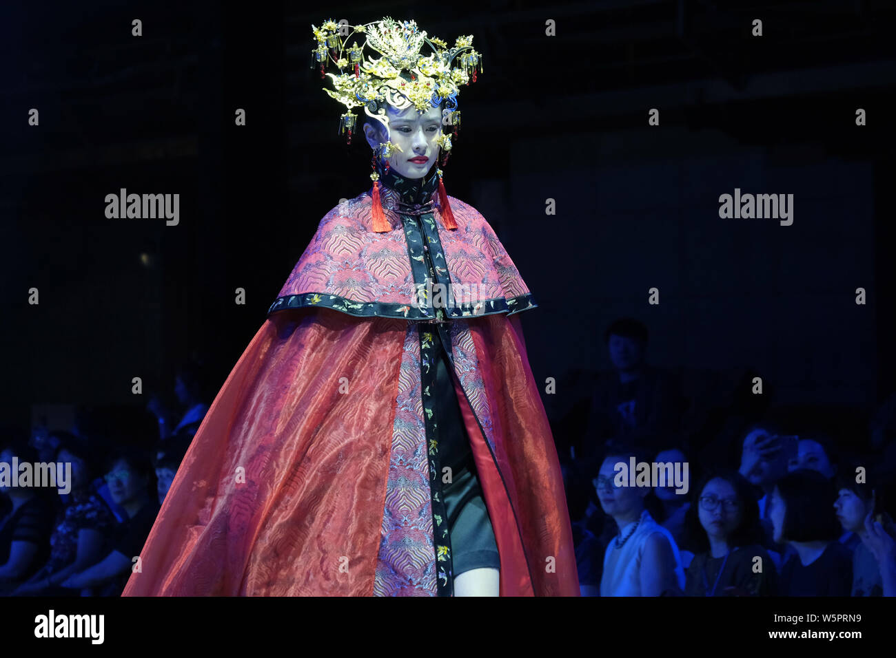 A model dressed in Cheongsam, a traditional Chinese dresses also known ...