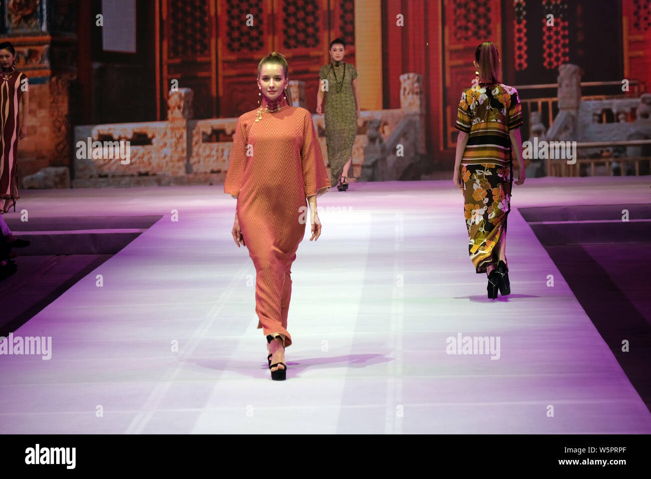 A model dressed in Cheongsam, a traditional Chinese dresses also known ...