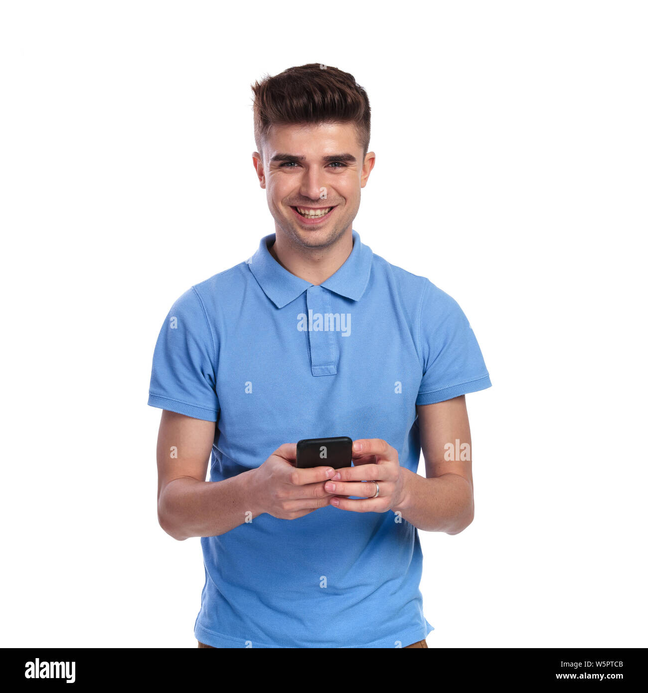 happy smiling young casual man sending sms on his phone on white ... happy smiling young casual man sending sms on his phone on white ...