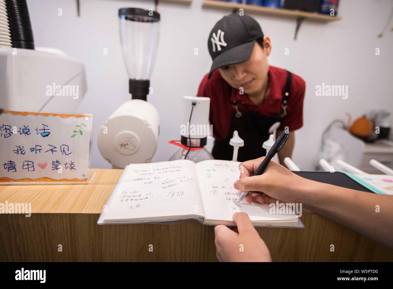 Chinese man Lu Jun and his wife Yang Di serve customers at their ...