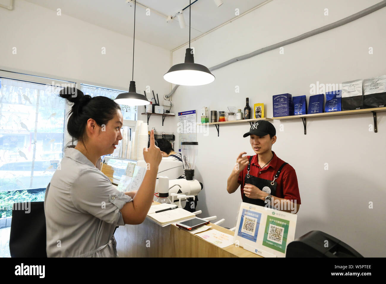 Chinese man Lu Jun and his wife Yang Di serve customers at their ...