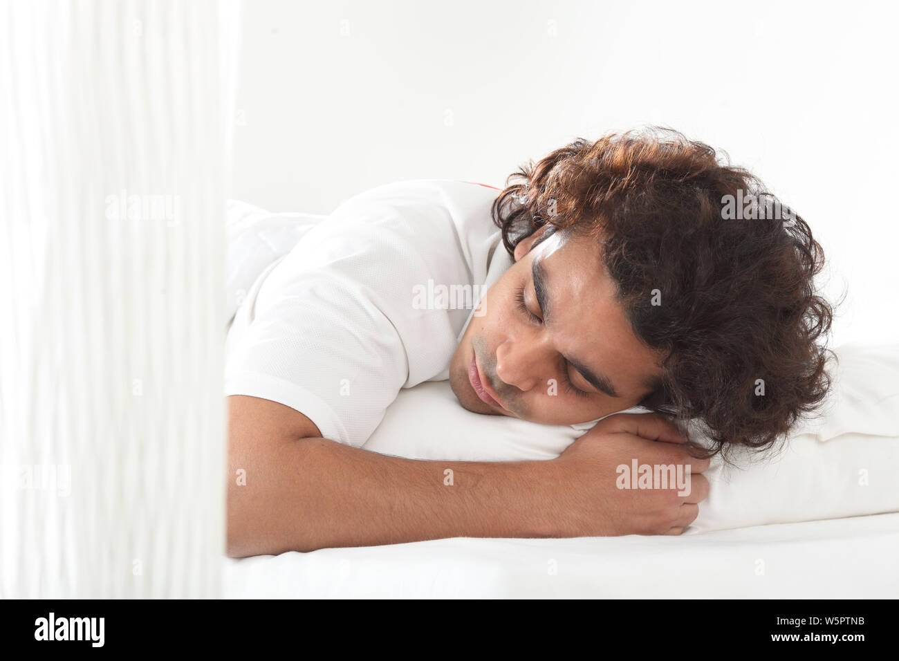 Man sleeping on the bed Stock Photo - Alamy