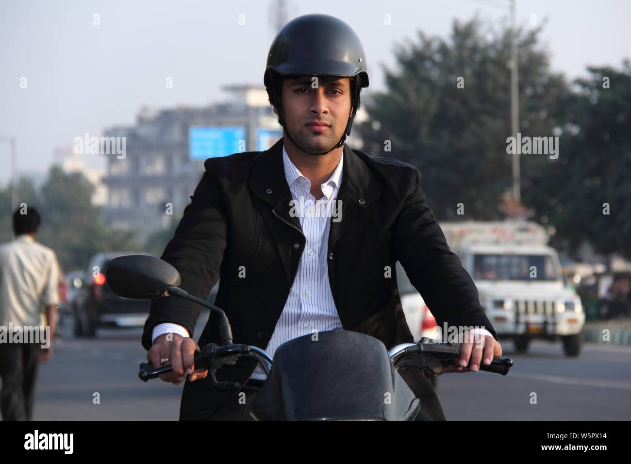 Man riding motorcycle in the road Stock Photo - Alamy