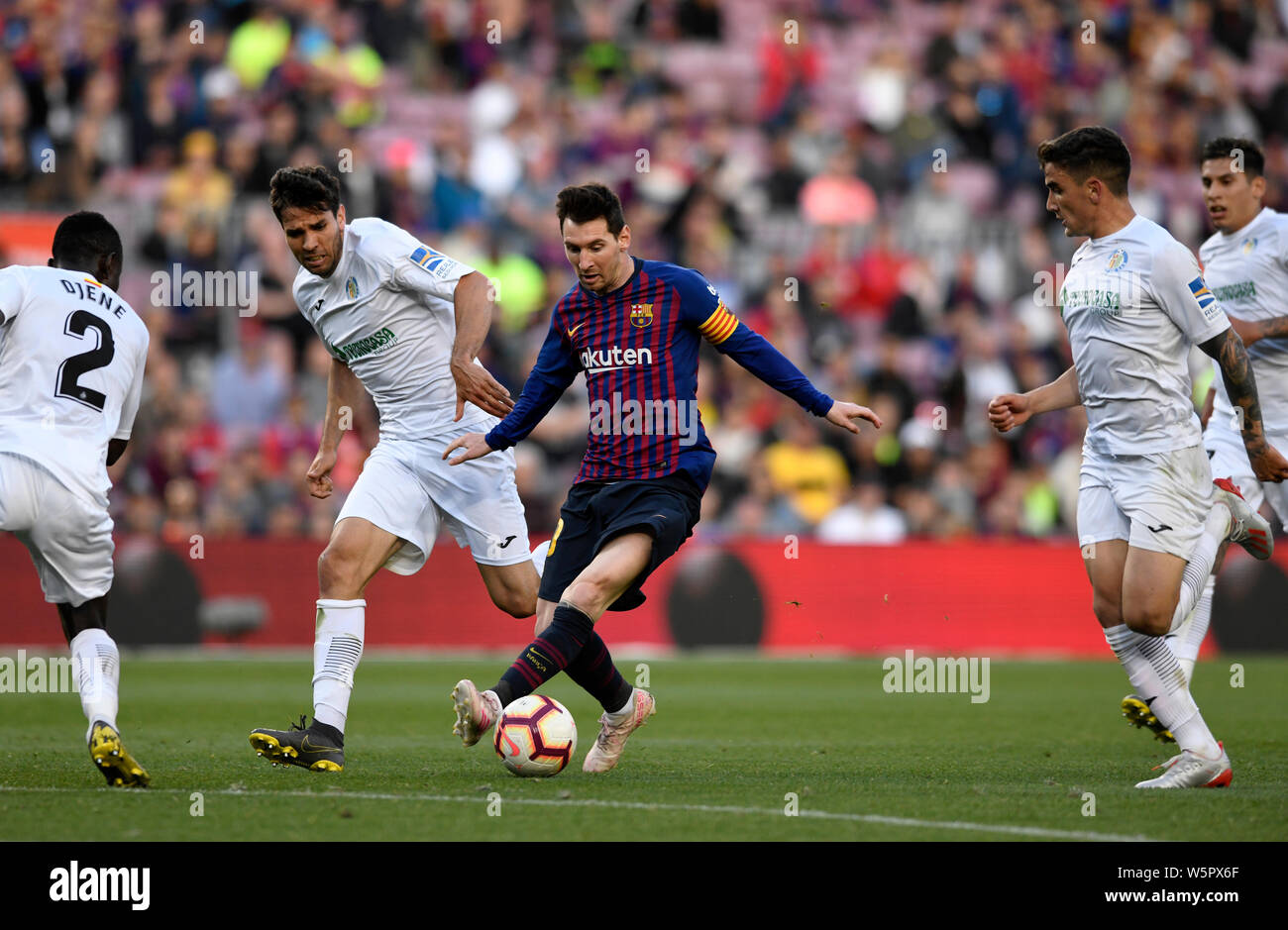 Lionel Messi, center, of FC Barcelona dribbles against Getafe CF during ...