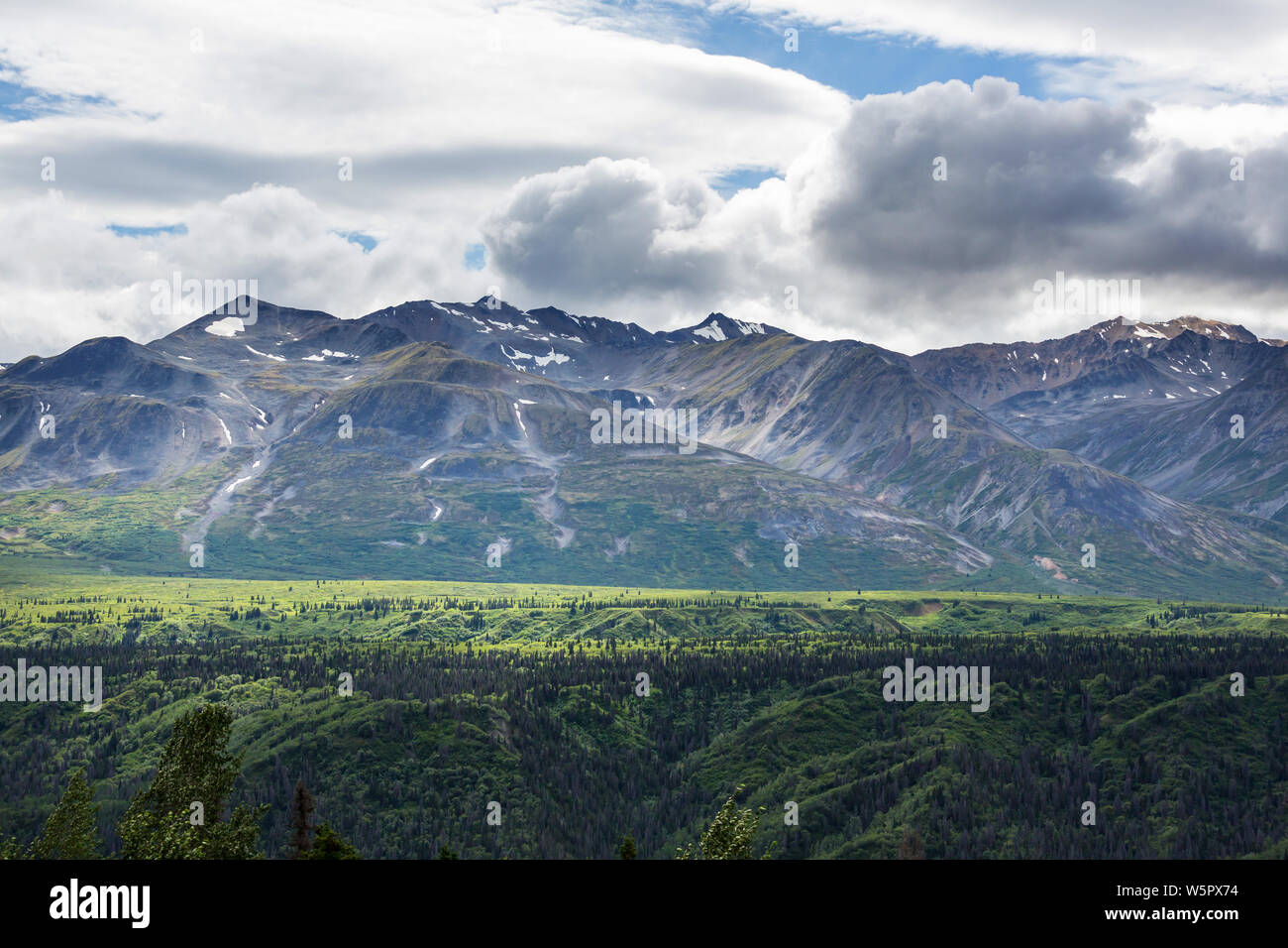 Picturesque Mountains of Alaska in summer. Snow covered massifs ...