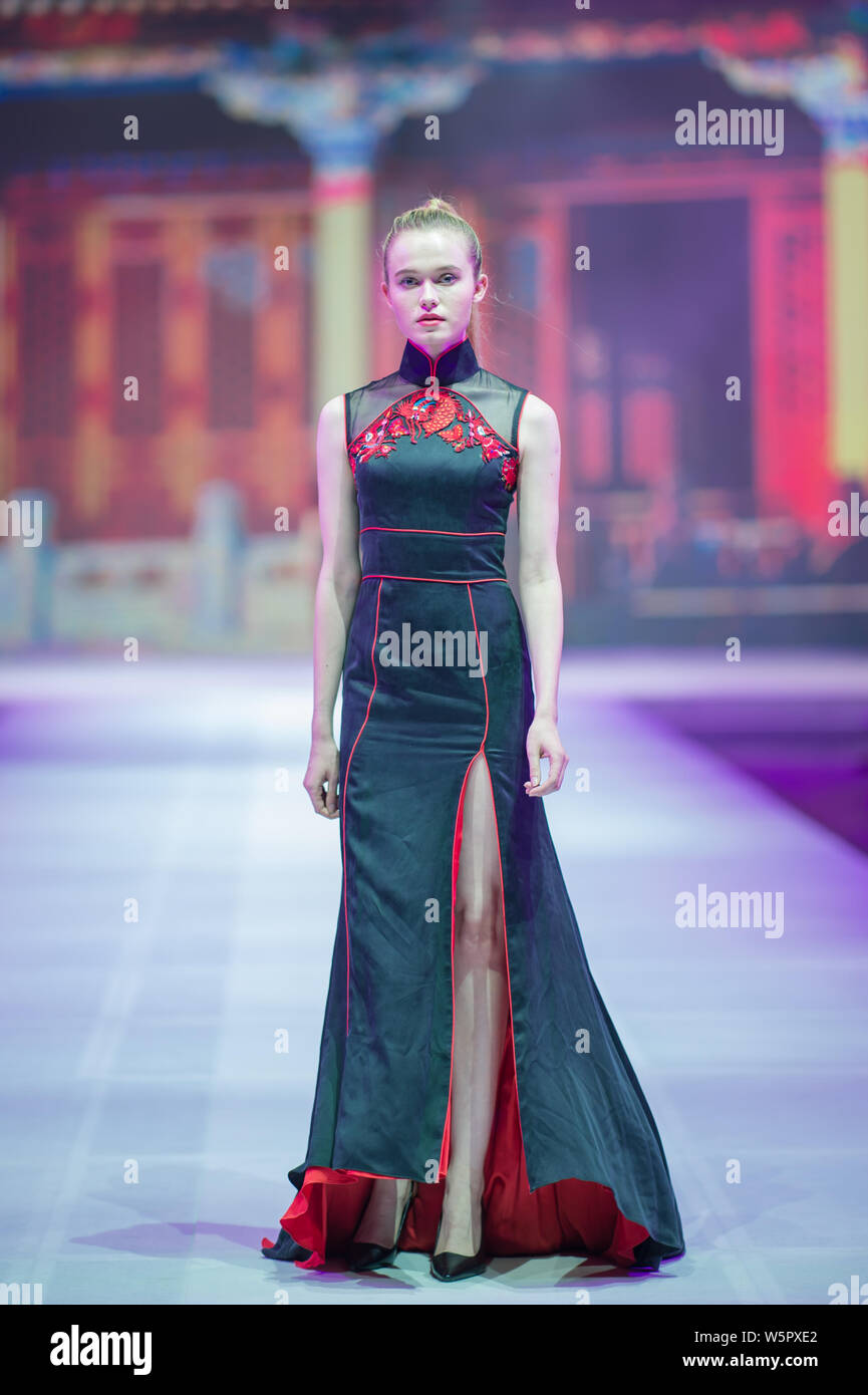 A model dressed in Cheongsam, a traditional Chinese dresses also known ...