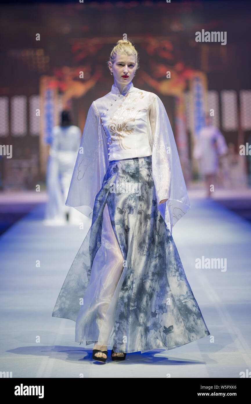 A model dressed in Cheongsam, a traditional Chinese dresses also known ...
