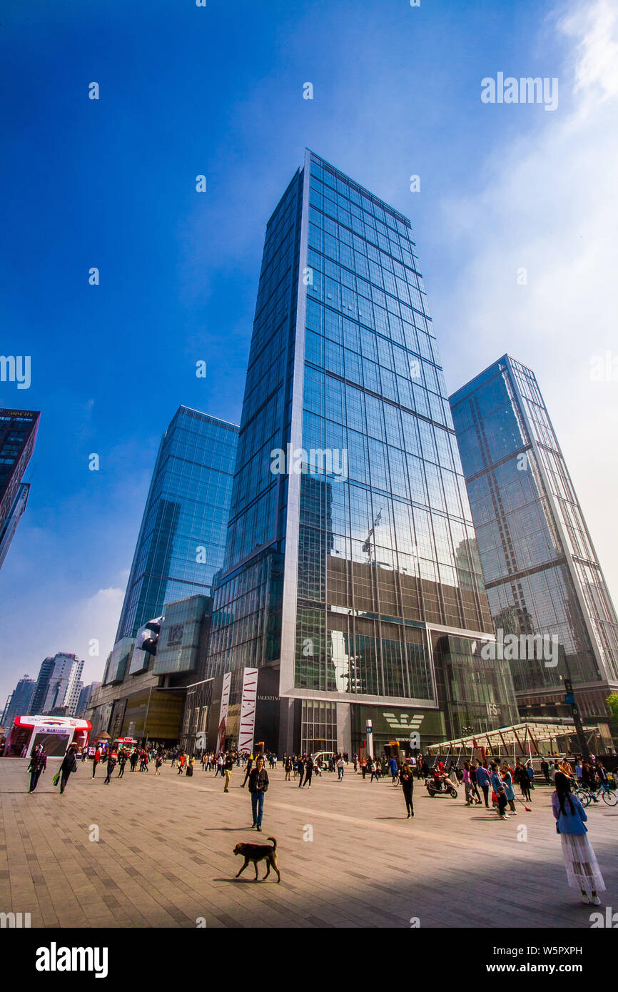 People walk past the Chengdu IFS (Chengdu International Finance Square ...